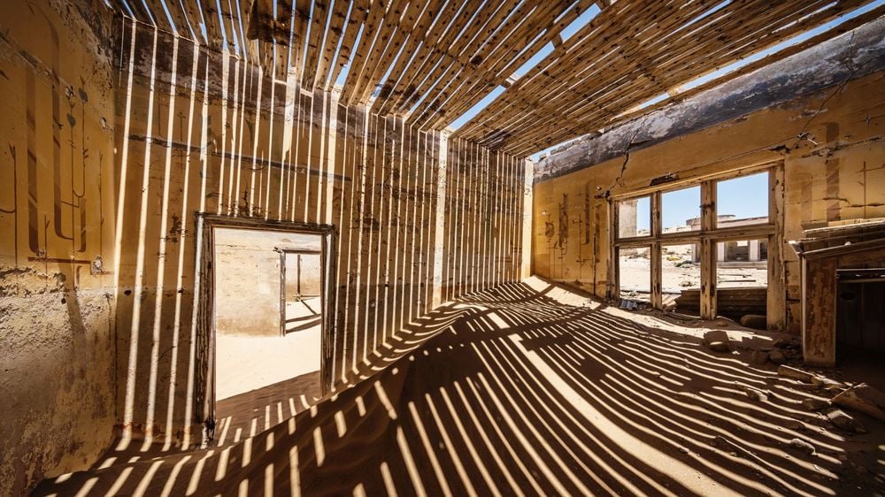 The Dark History of Kolmanskop - Namibia’s Abandoned Diamond Town